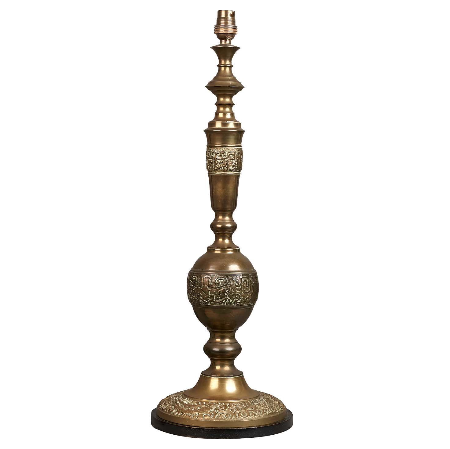 A mid 20th century brass/bronze engraved table lamp on turned ebonised